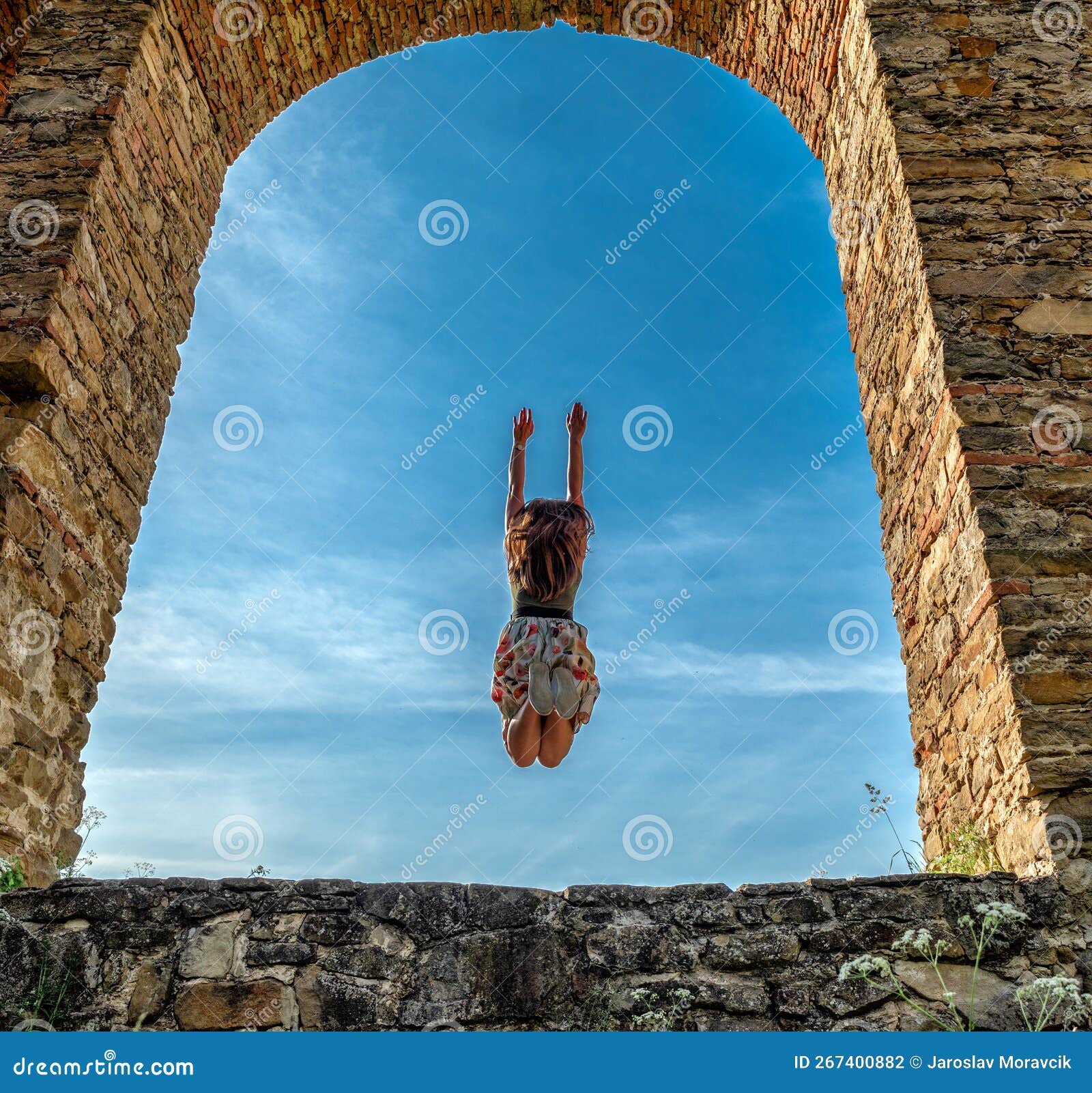 Happy Girl Jumping in Large Window and Blue Sky at Background Stock ...