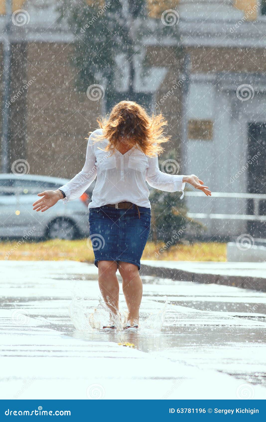 Happy Girl Jumping in Puddle Stock Photo - Image of cheerful, freedom ...