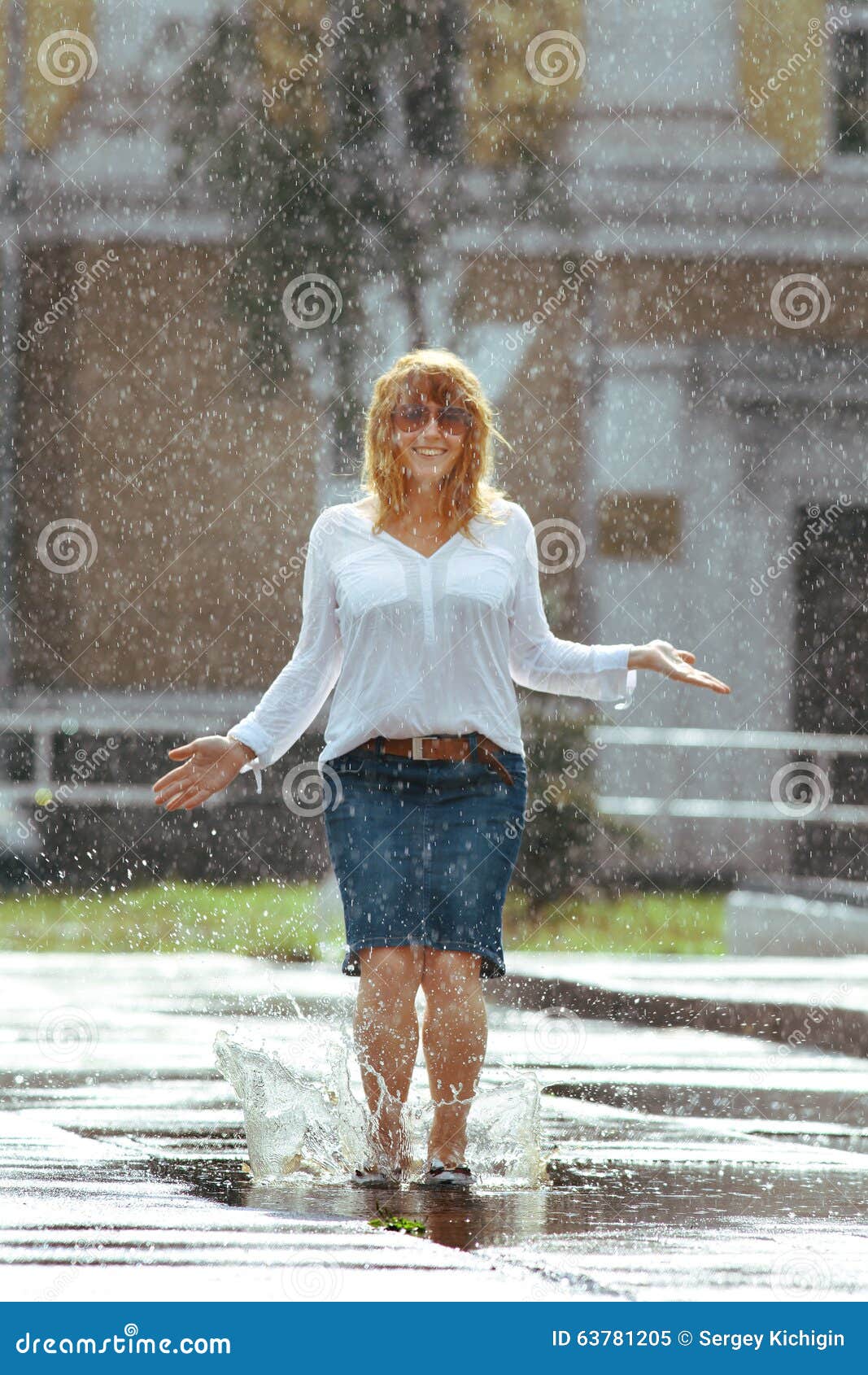 Happy Girl Jumping in Puddle Stock Image - Image of cheerful, person ...
