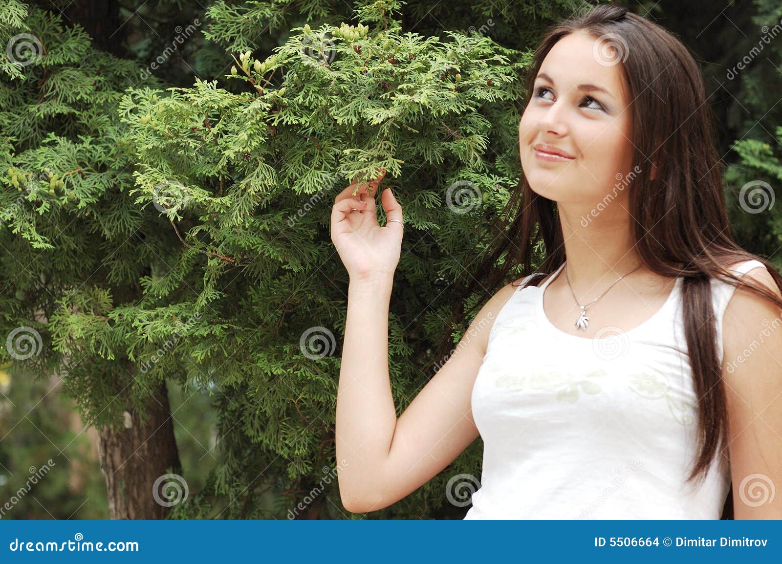 Happy girl by leafy tree stock photo. Image of pretty - 5506664