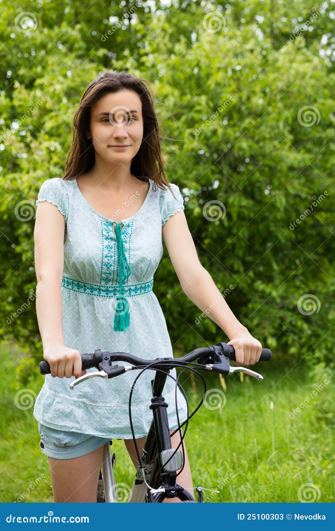 Happy girl over a bicycle stock image. Image of green - 25100303