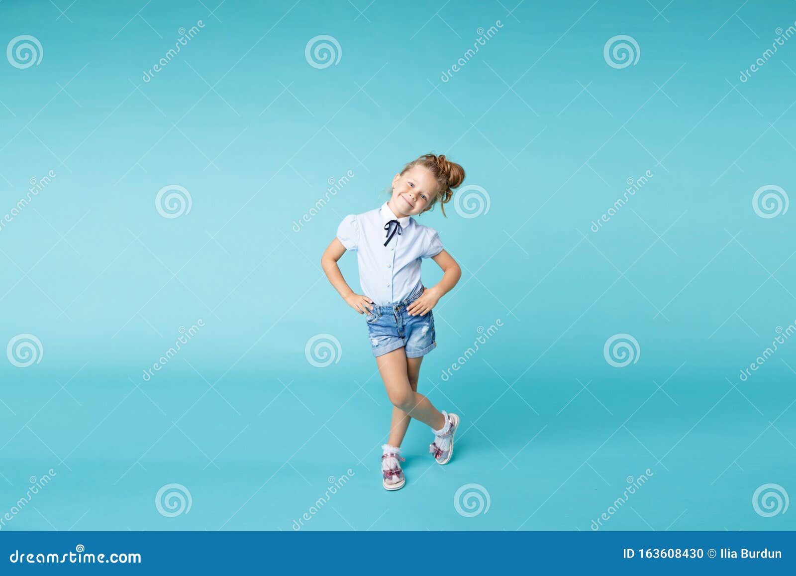 Happy Girl Posing in the Studio Isolated. Stock Photo - Image of happy ...