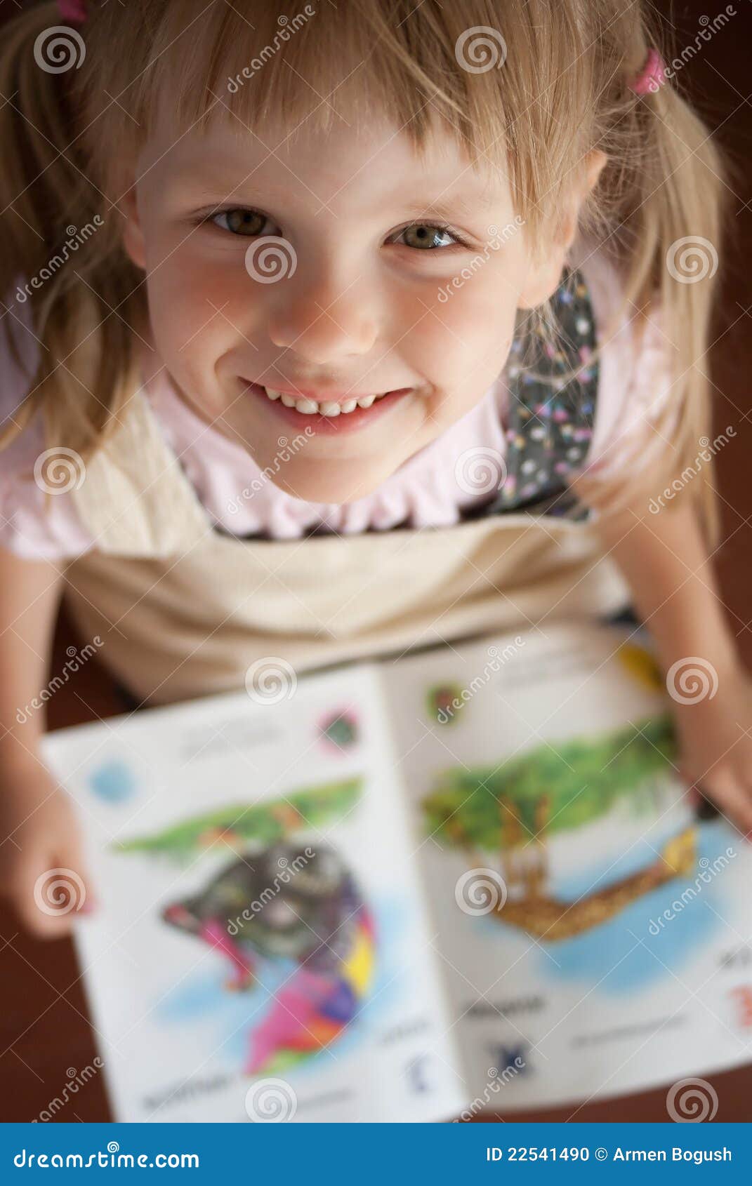 Happy girl reading book stock photo. Image of educational - 22541490