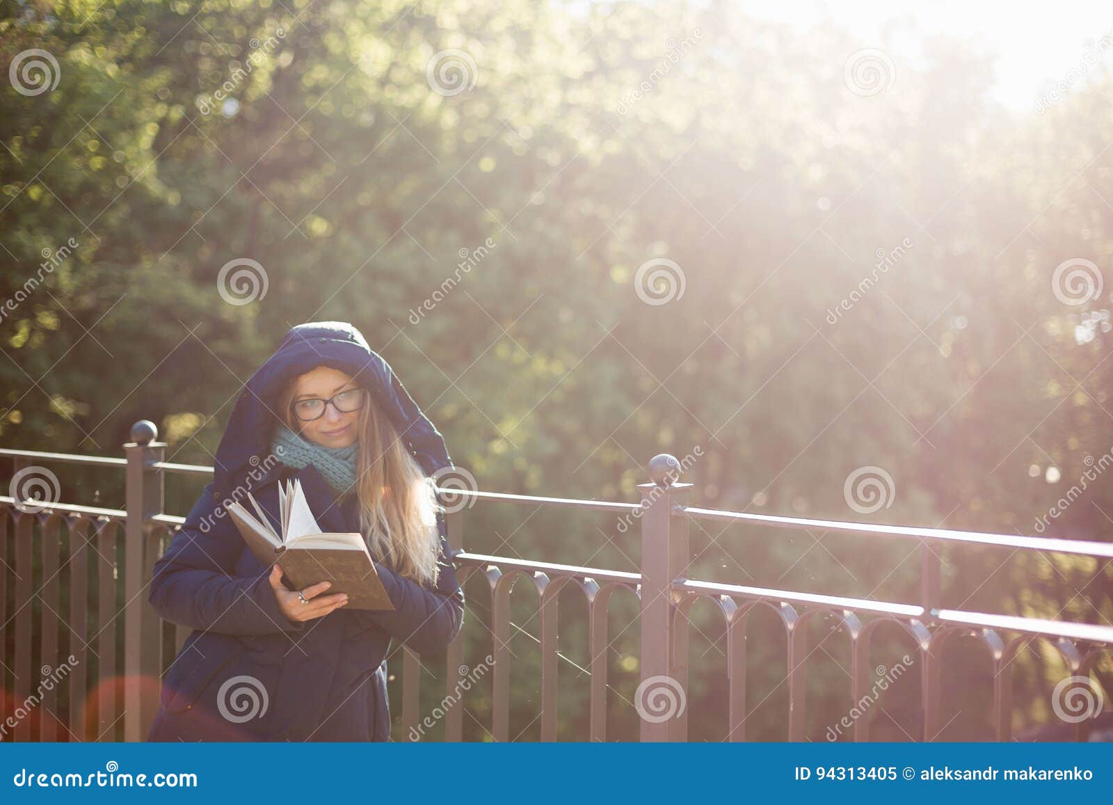 Happy Girl Reading a Book at the Railing. Stock Image - Image of room ...