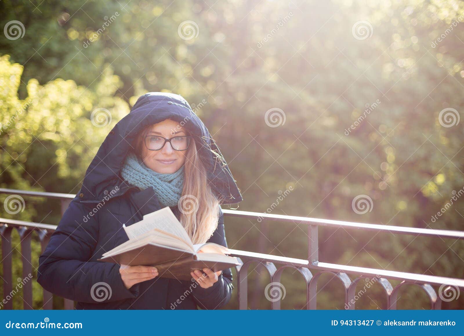 Happy Girl Reading a Book at the Railing. Stock Image - Image of hall ...