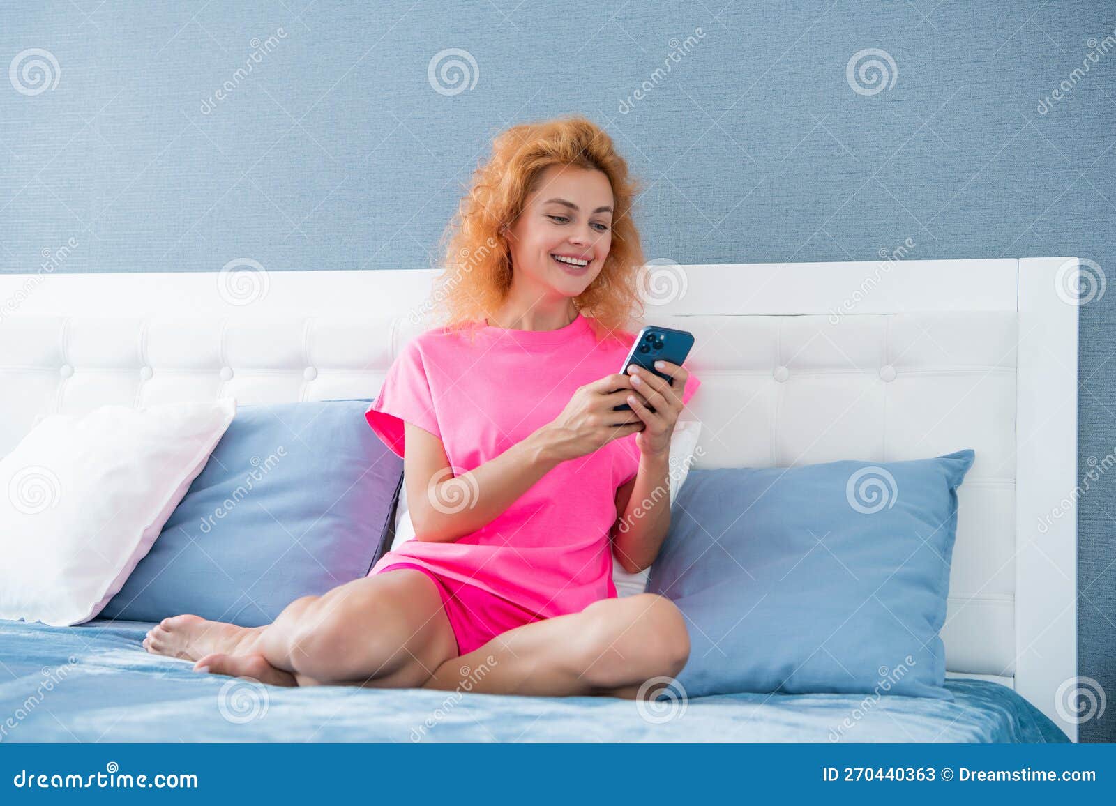 Happy Girl Relax at Home and Texting on Phone. Girl Texting on Phone on ...
