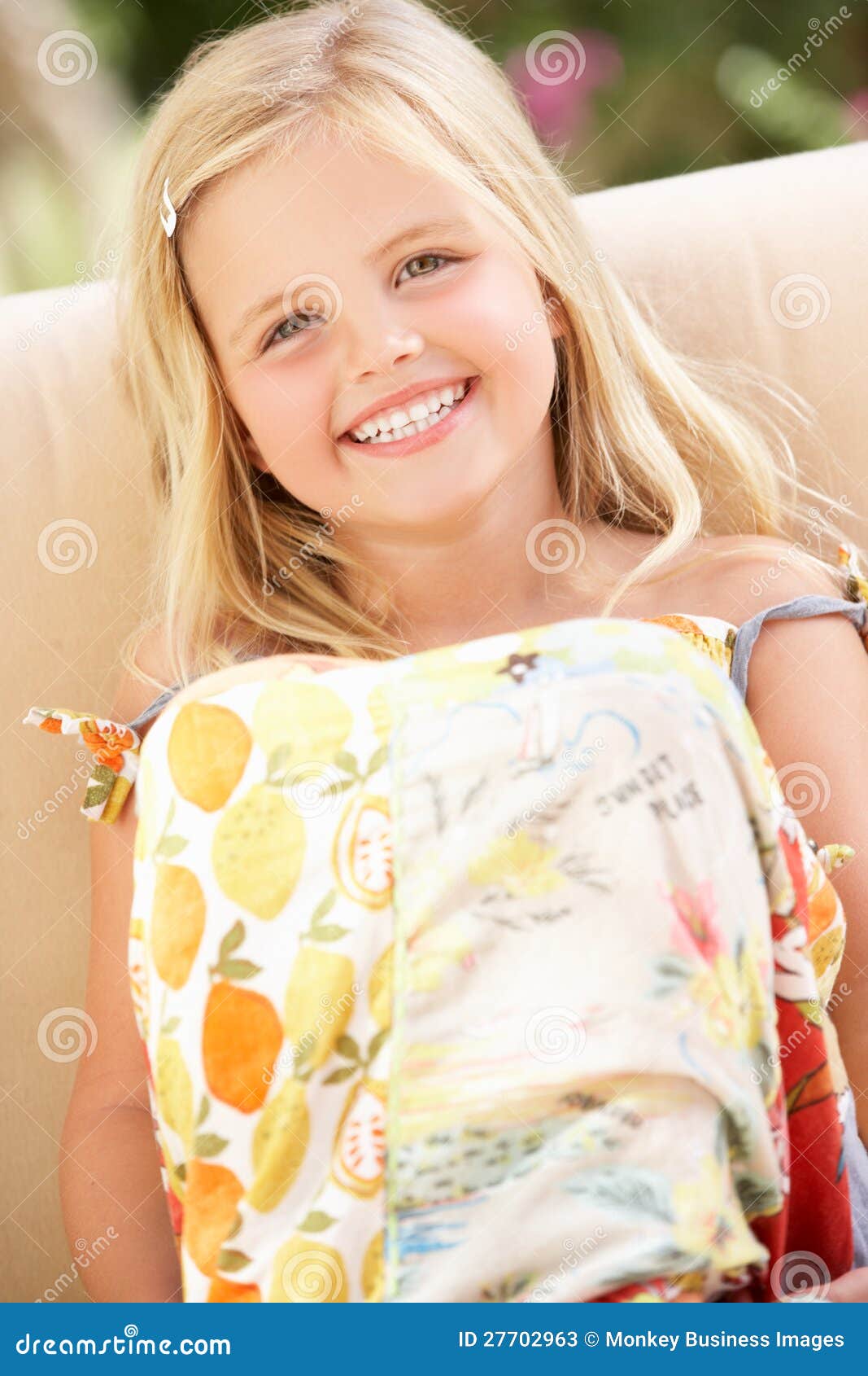 Happy Girl Sitting on Sofa stock image. Image of camera - 27702963