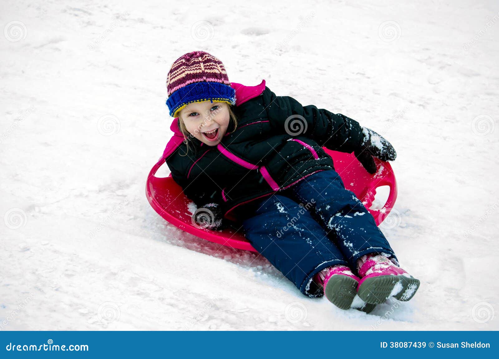 Happy Girl Sledding Down a Snowy Hill Stock Image - Image of cold ...