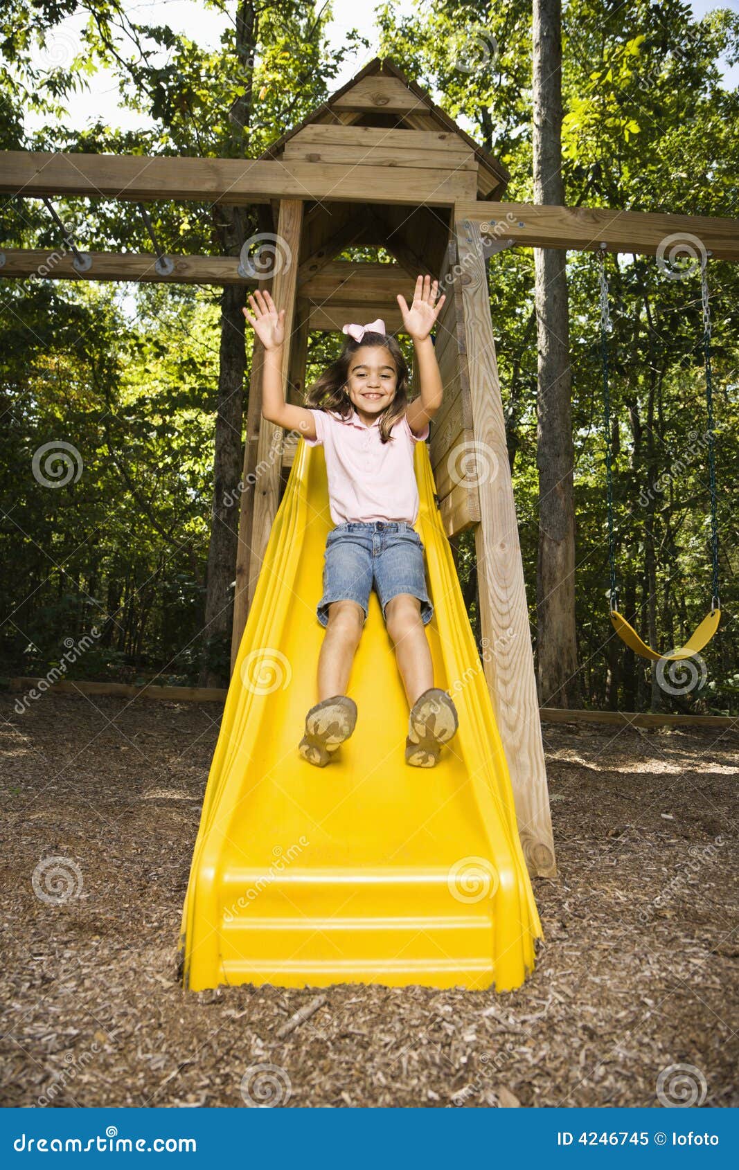 Happy girl sliding. stock image. Image of photograph, brunette - 4246745