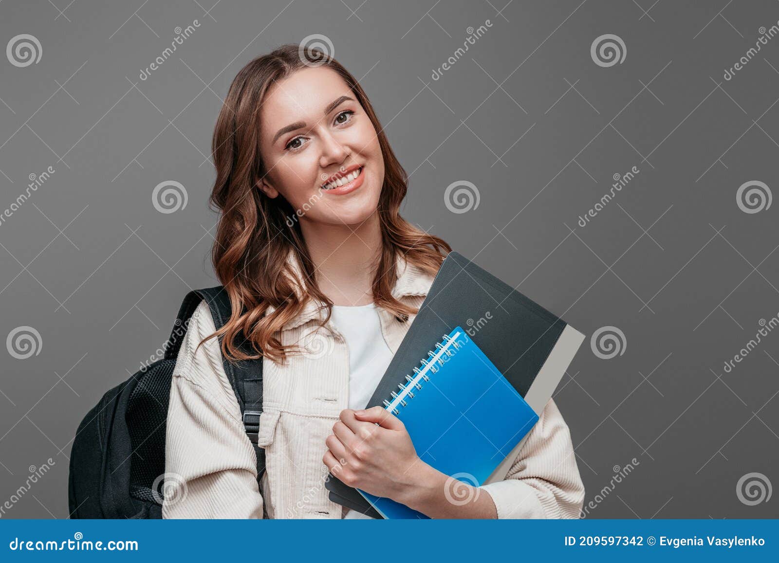 Happy Girl Student in Bright Clothes Holding a Notebook, Notepad, a ...