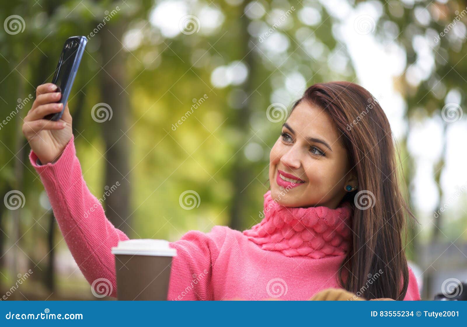 Happy Girl Taking Self Picture Selfie With Smartphone Camera Outdoors