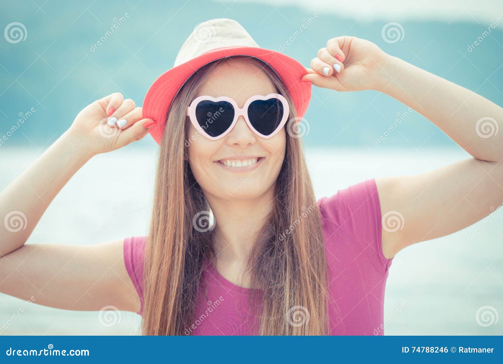 Happy Girl Tourist In Straw Hat And Sunglasses On Beach Free Time On