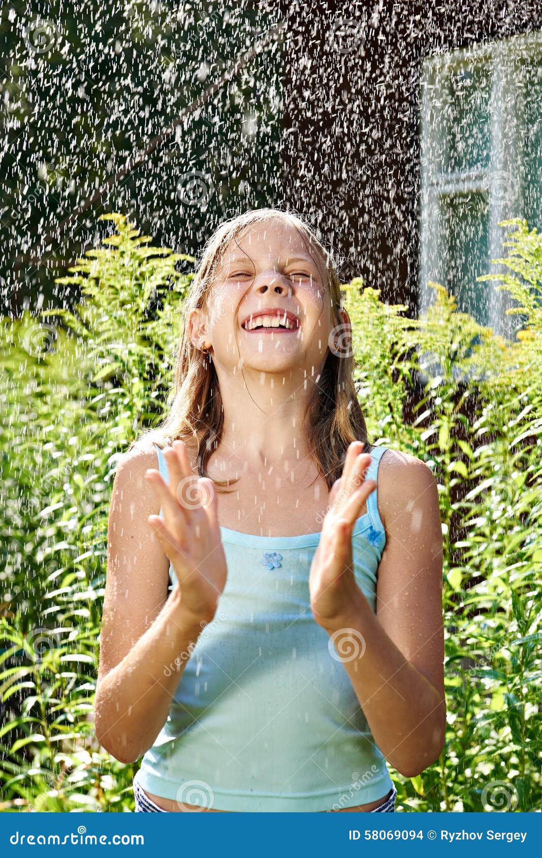 Happy girl under rain stock photo. Image of teeth, hands - 58069094