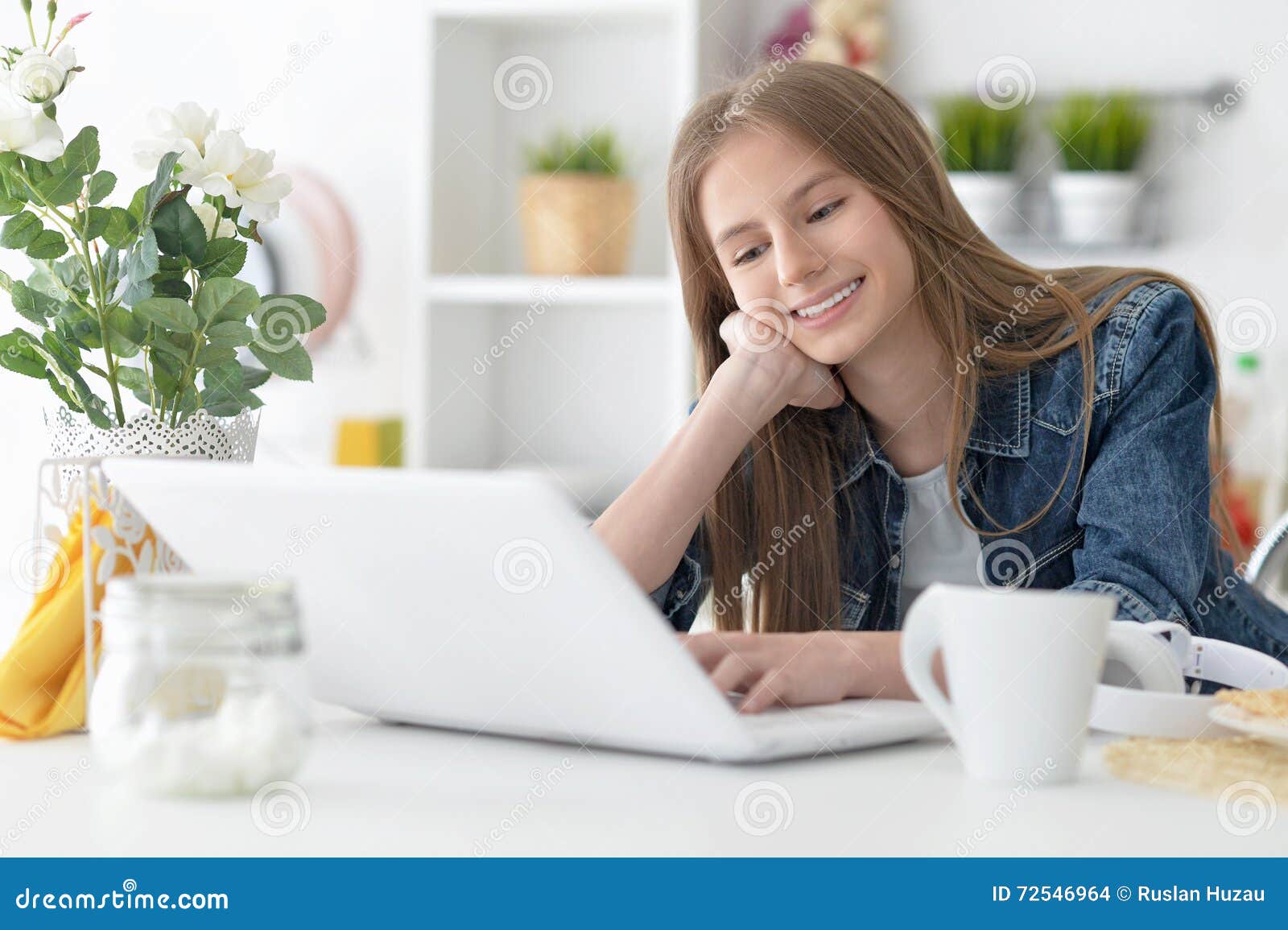 Happy girl using laptop stock photo. Image of modern - 72546964