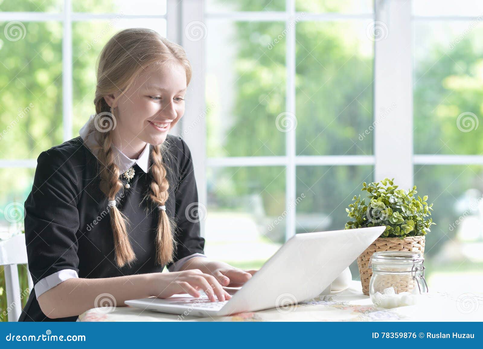 Happy girl using laptop stock photo. Image of portable - 78359876