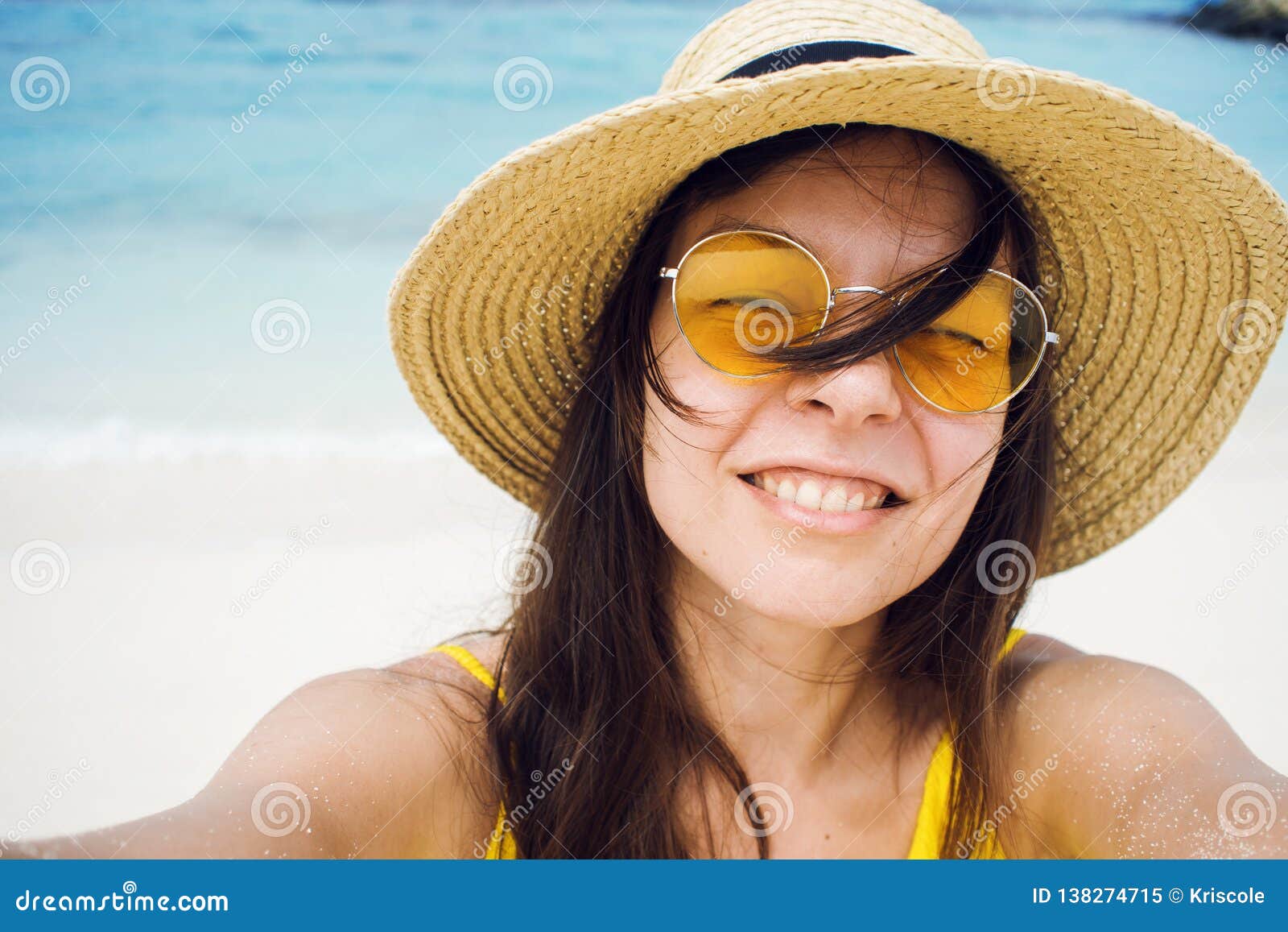 Happy Girl On Vacation Young Brunette In A Straw Hat And Sunglasses