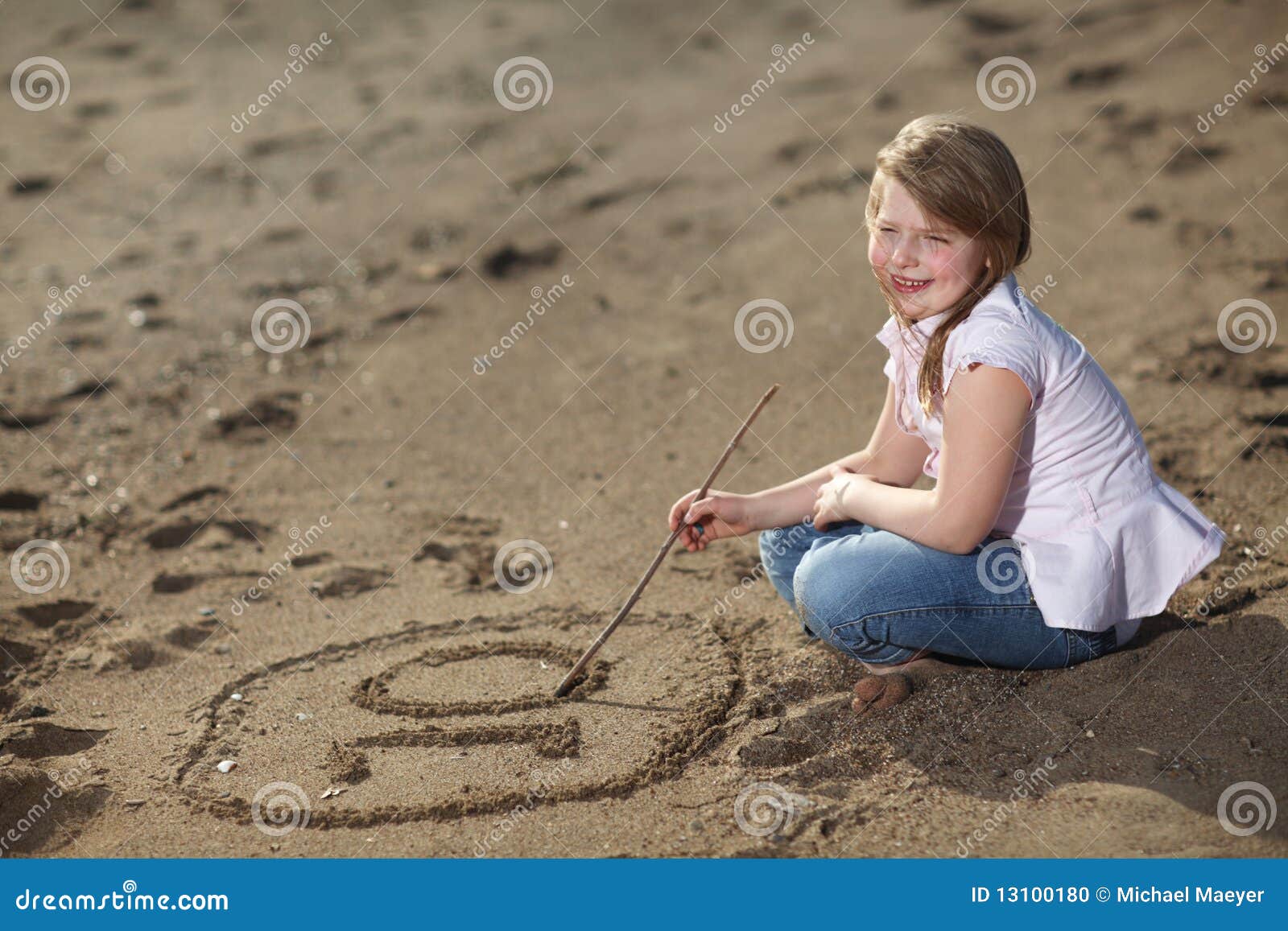 Happy Girl Writing Number in the Sand Stock Photo - Image of sand ...