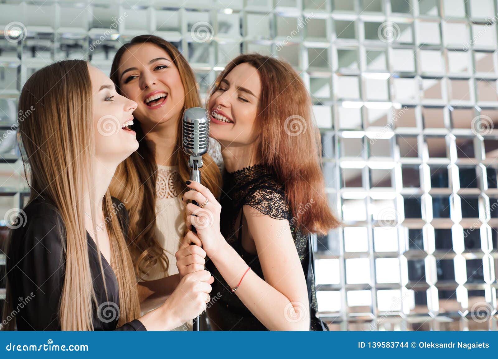 Happy Girls Having Fun Singing at a Party. Stock Photo - Image of ...