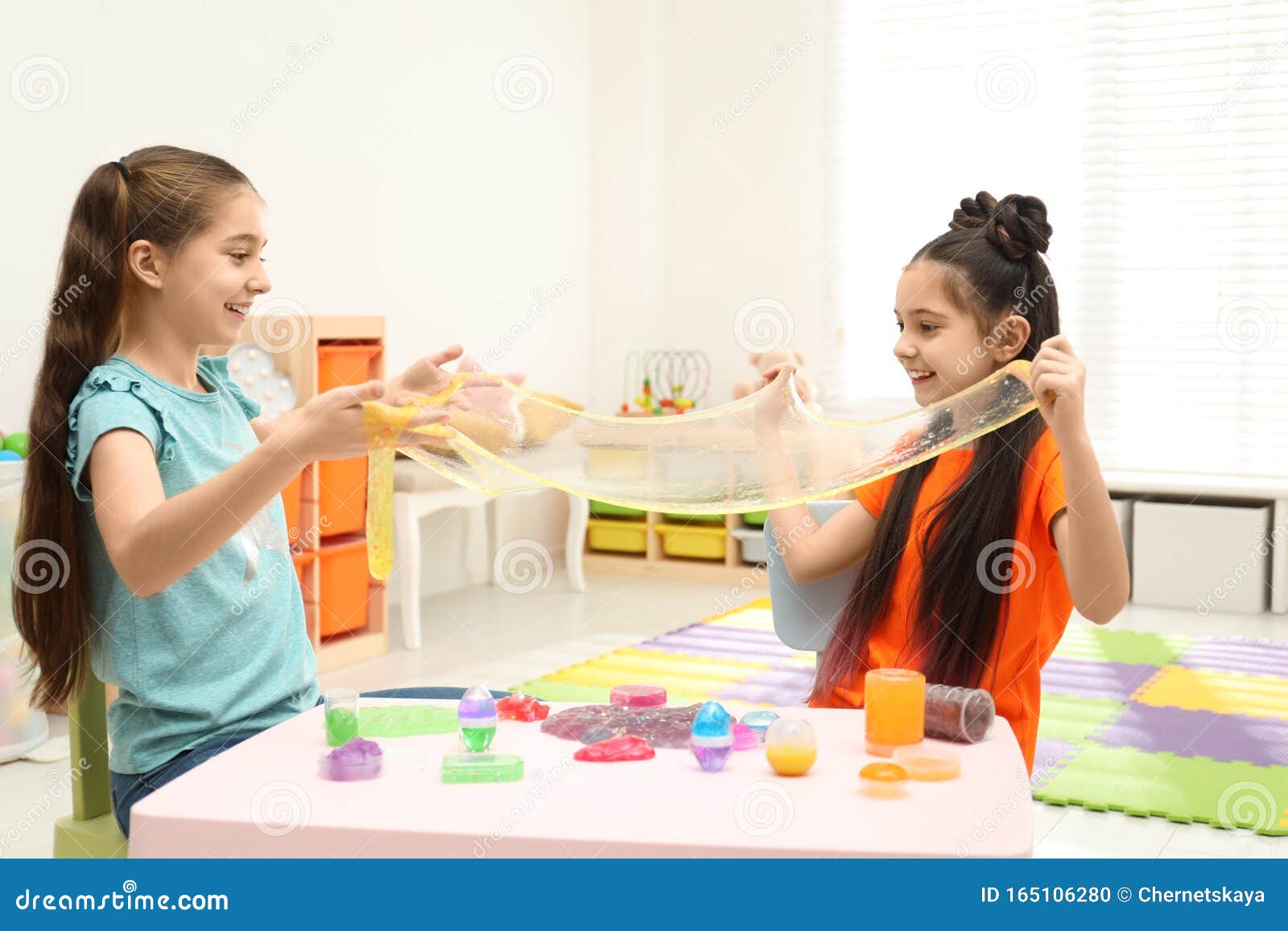 Happy Girls Playing with Slime Stock Photo - Image of glitter ...