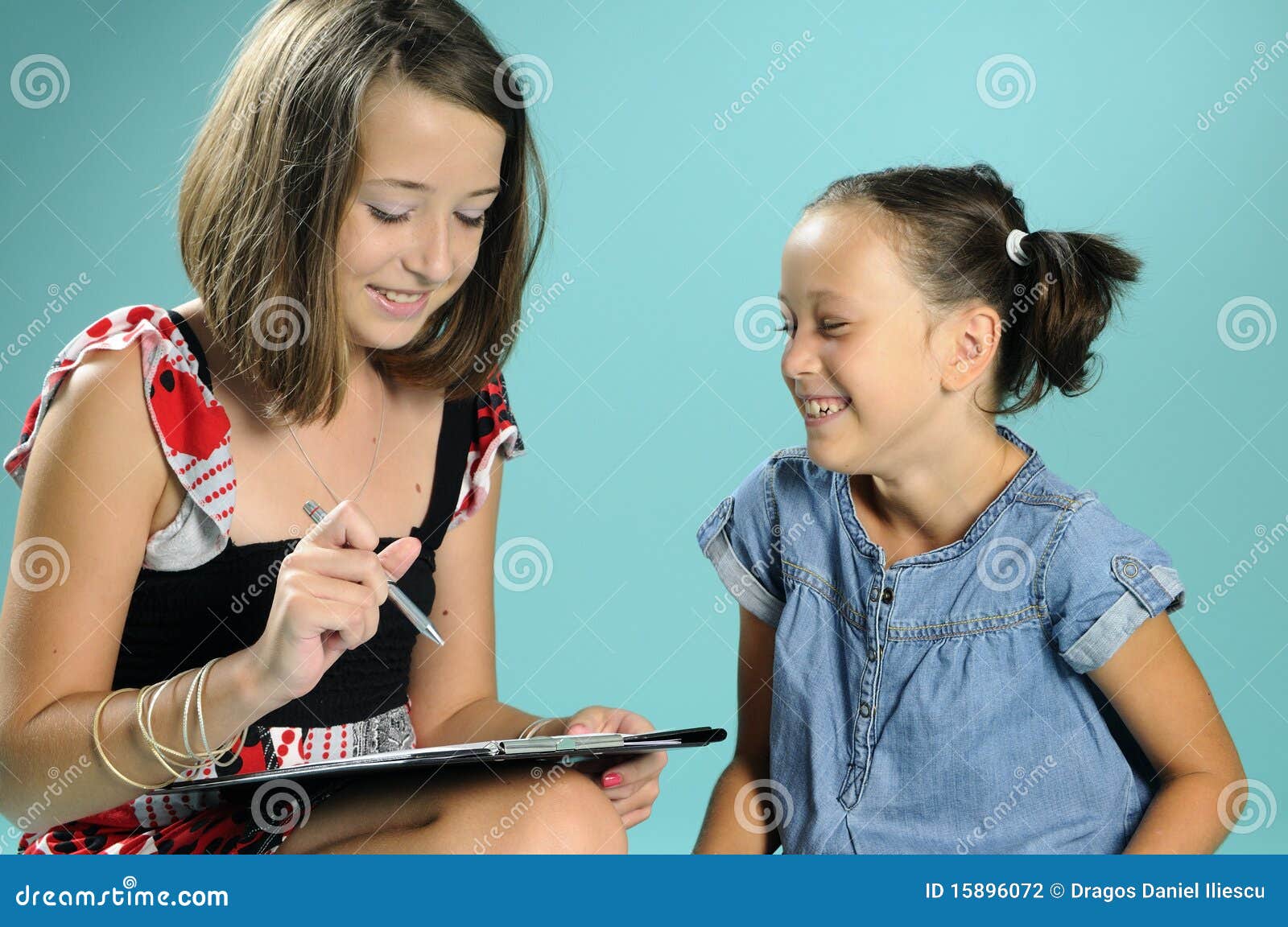 Happy girls writing stock photo. Image of education, caucasian - 15896072