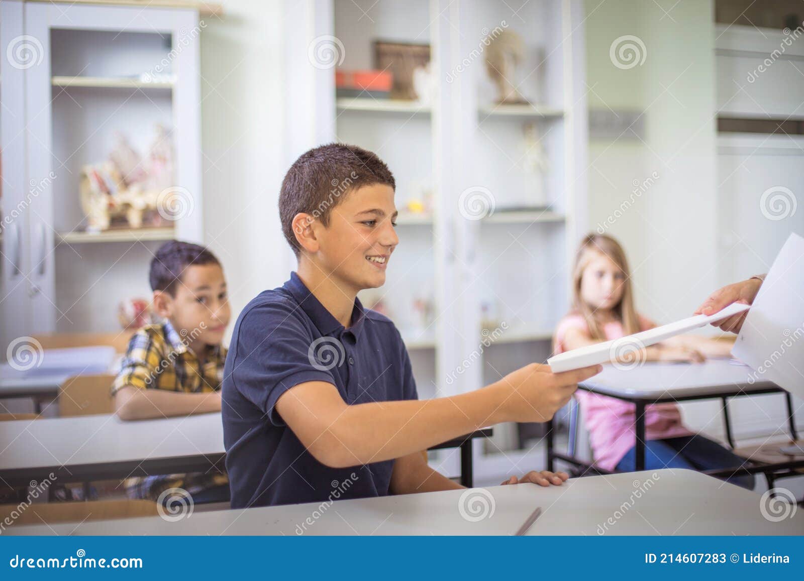 Teens in Class. the Teacher Gives Them Control Tasks Stock Image ...