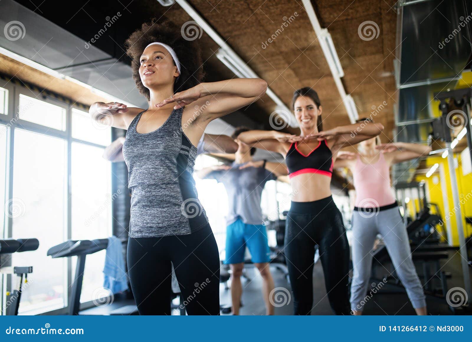 Happy Gorup of Healthy People Training in Gym Stock Photo - Image of ...