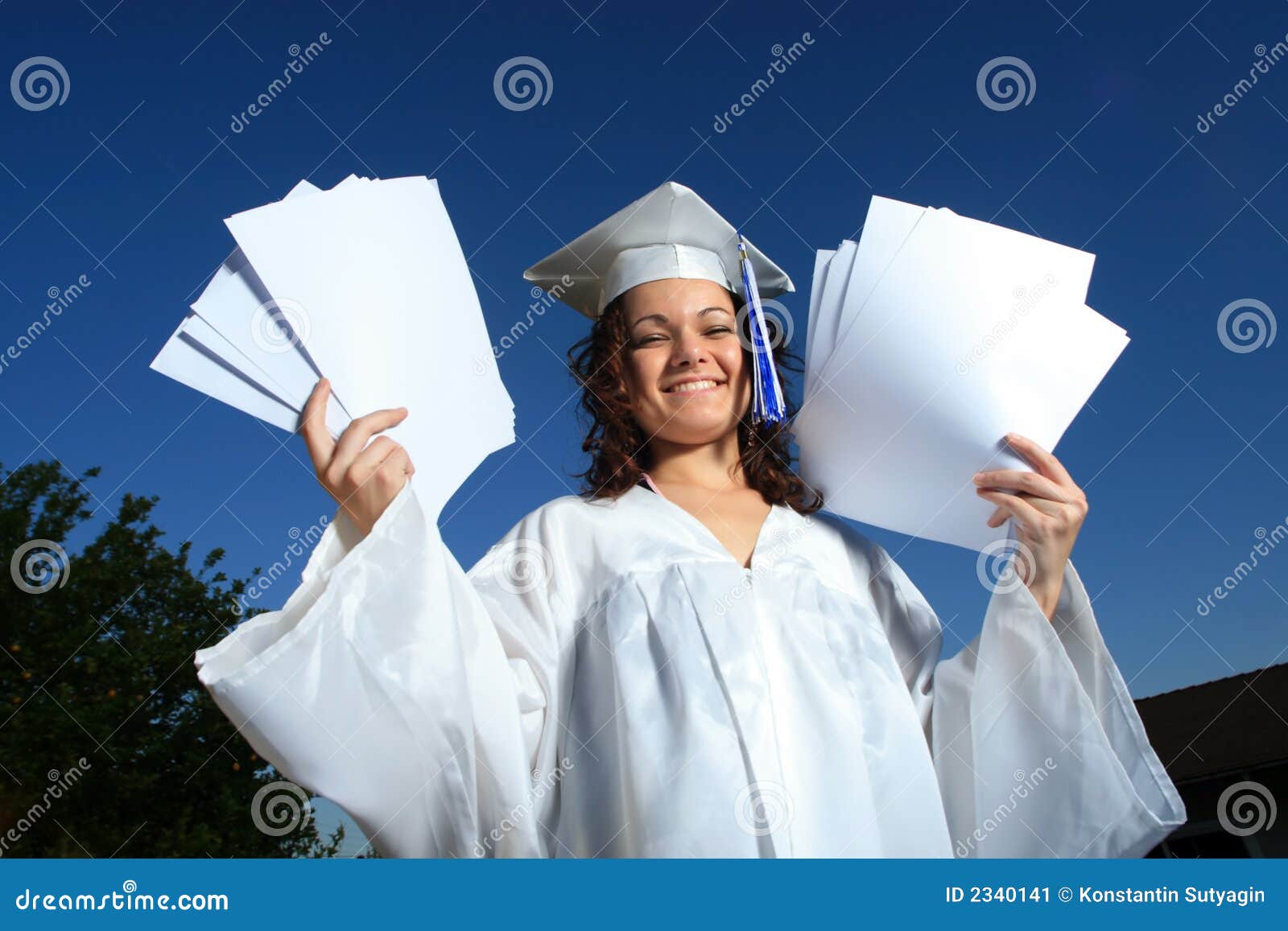 Happy graduate with papers stock image. Image of attractive - 2340141