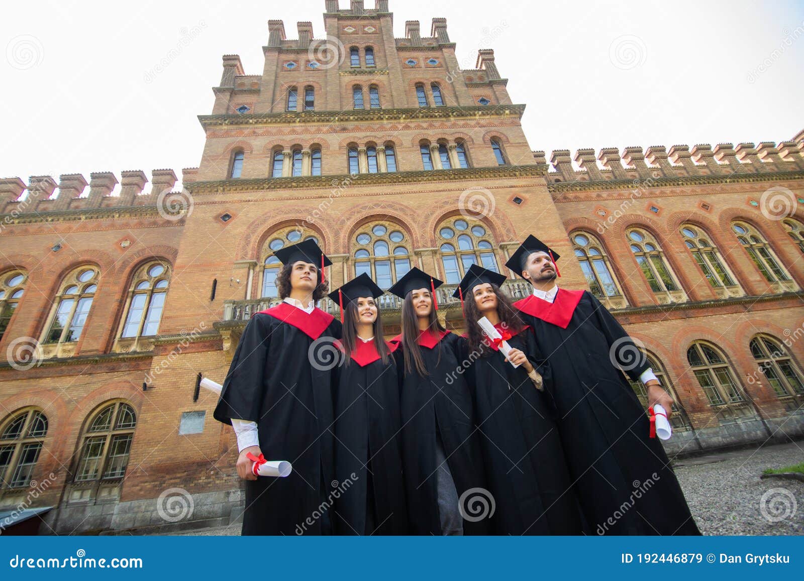 Happy Graduates. Five College Graduates Standing in a Row and Smiling ...
