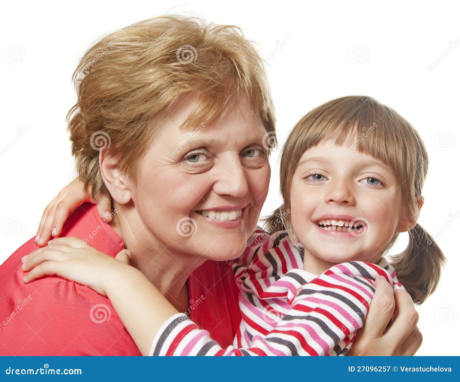 Grandmother With Granddaughter Laughing Together On Sofa Royalty Free
