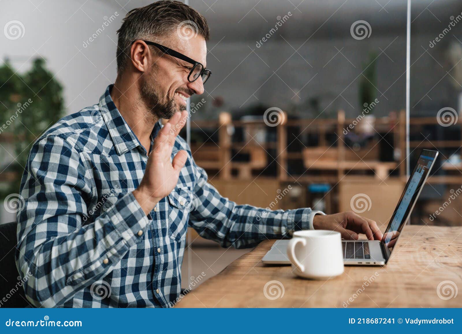 Happy Grey Man Waving Hand while Working with Laptop Stock Image ...