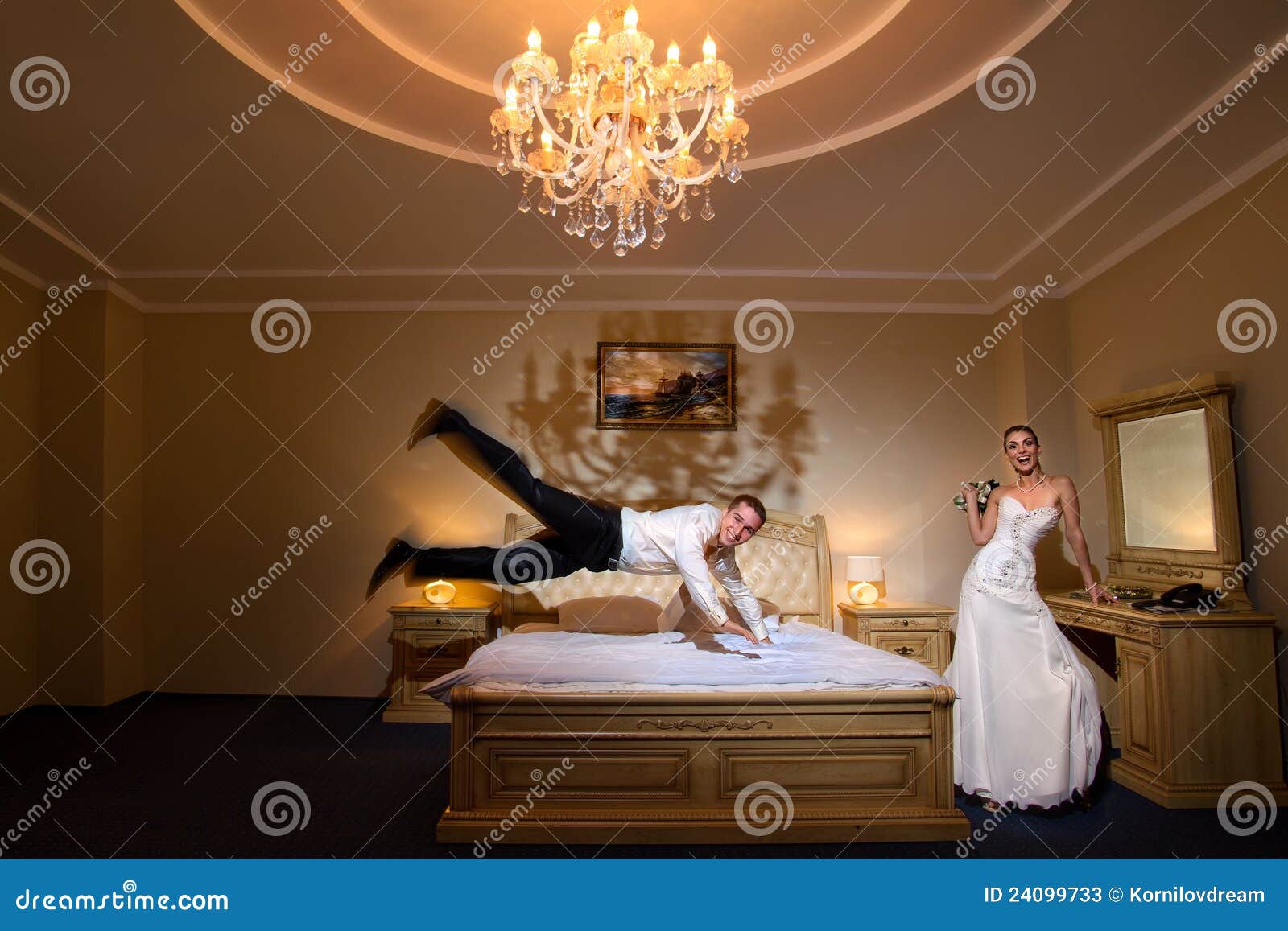 Happy groom flying on bed stock image. Image of bride - 24099733