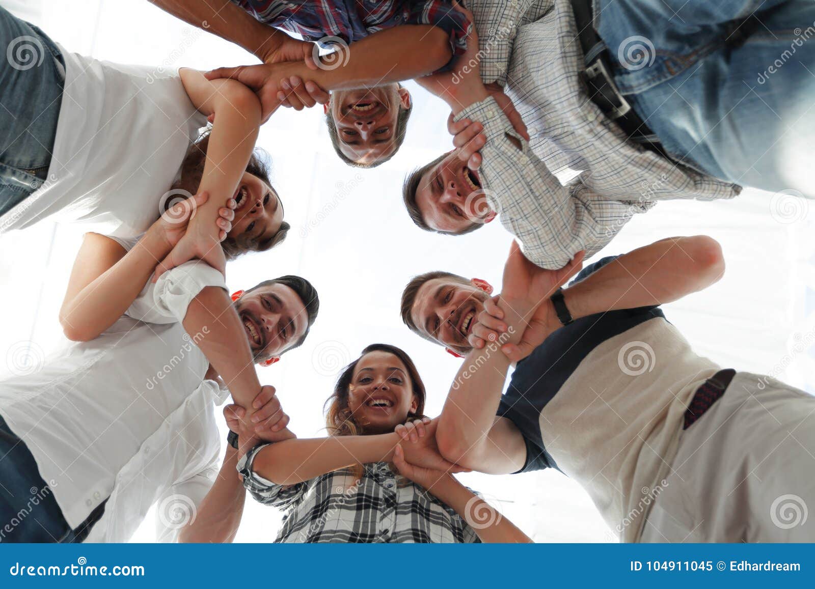 Happy Group of Businesspeople Stacking Their Hands in Cooperation Stock ...