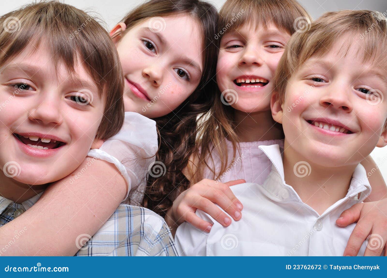 Happy Group of Children Hugging Together Stock Photo - Image of ...