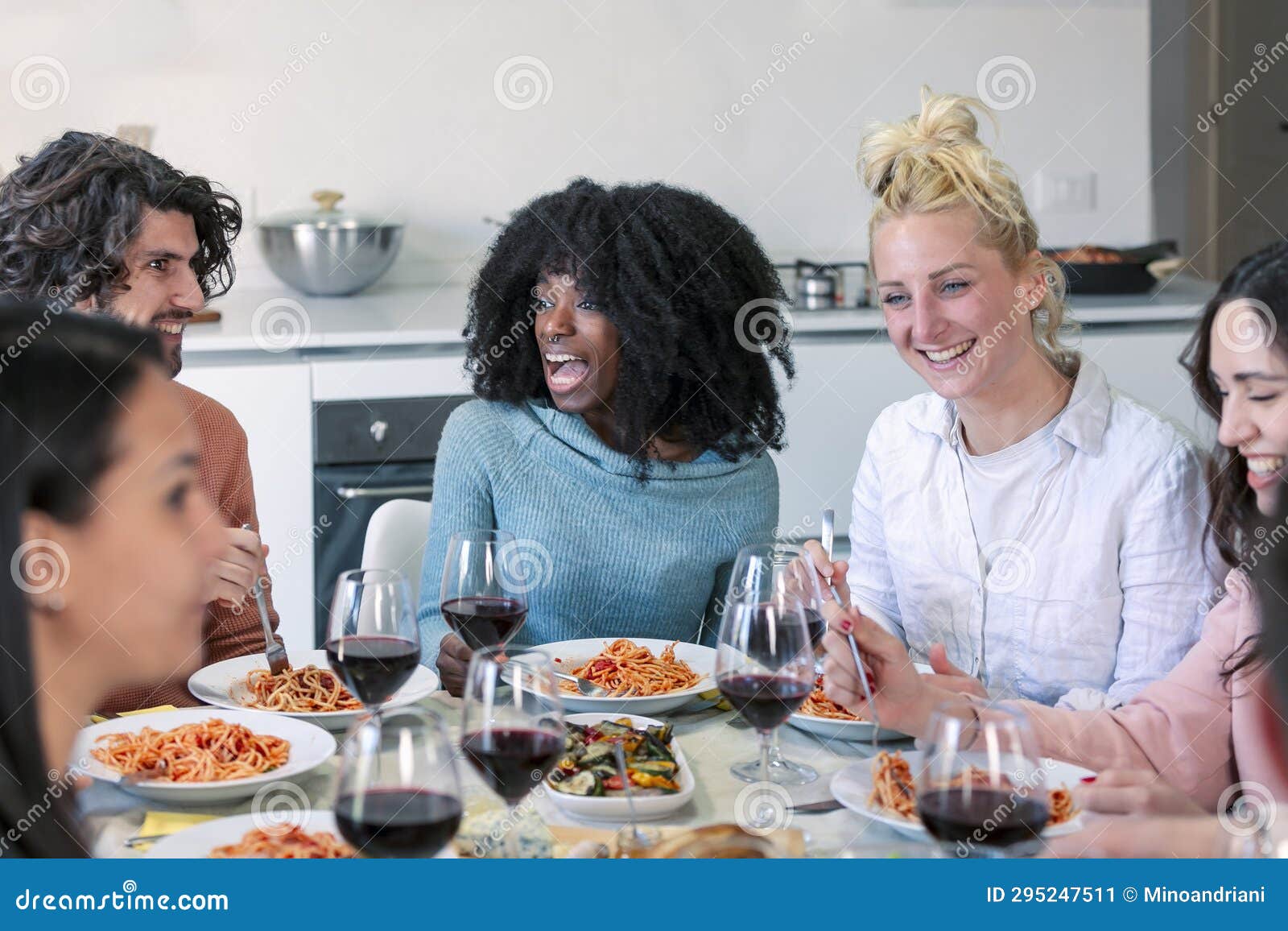 Happy Group of Friends Eating Pasta at Home Dinner Party Stock Image ...