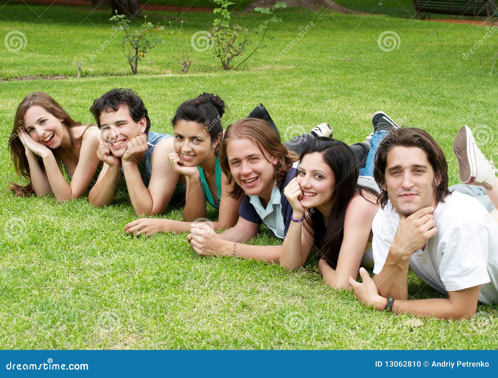 Happy Group of Friends Smiling in a Park Stock Photo - Image of boys ...