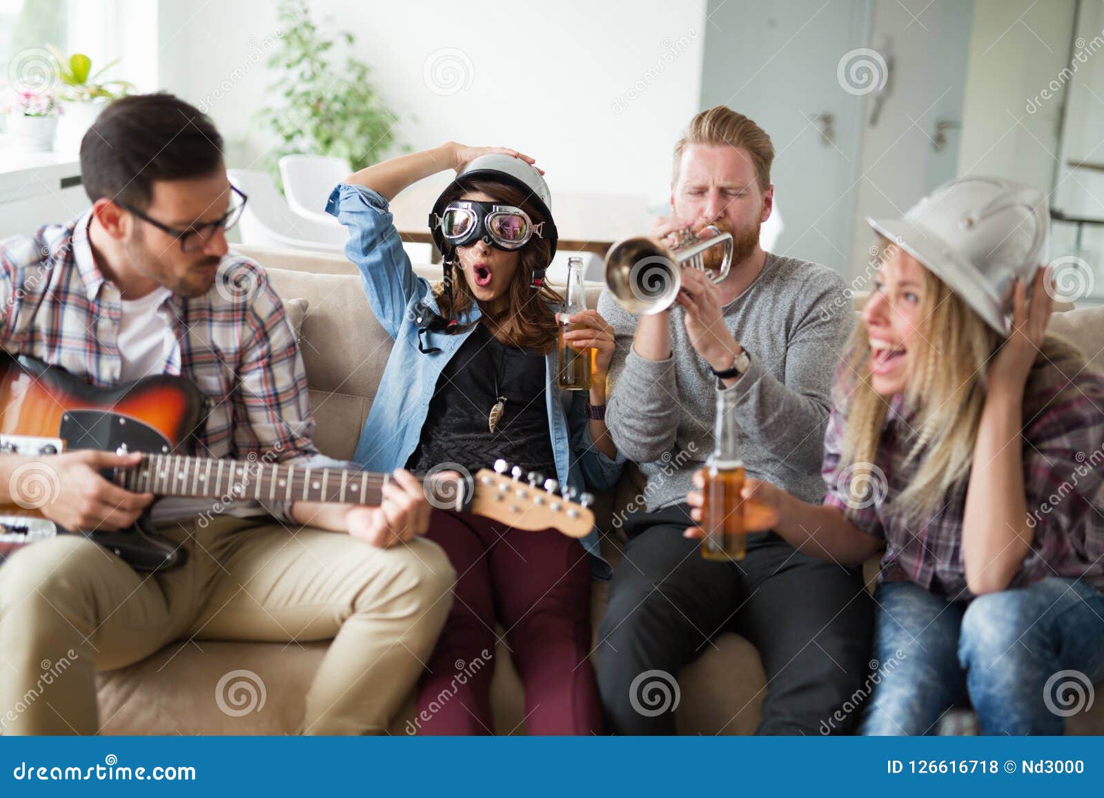 Happy Group of Friends Playing Instruments and Partying Stock Photo ...
