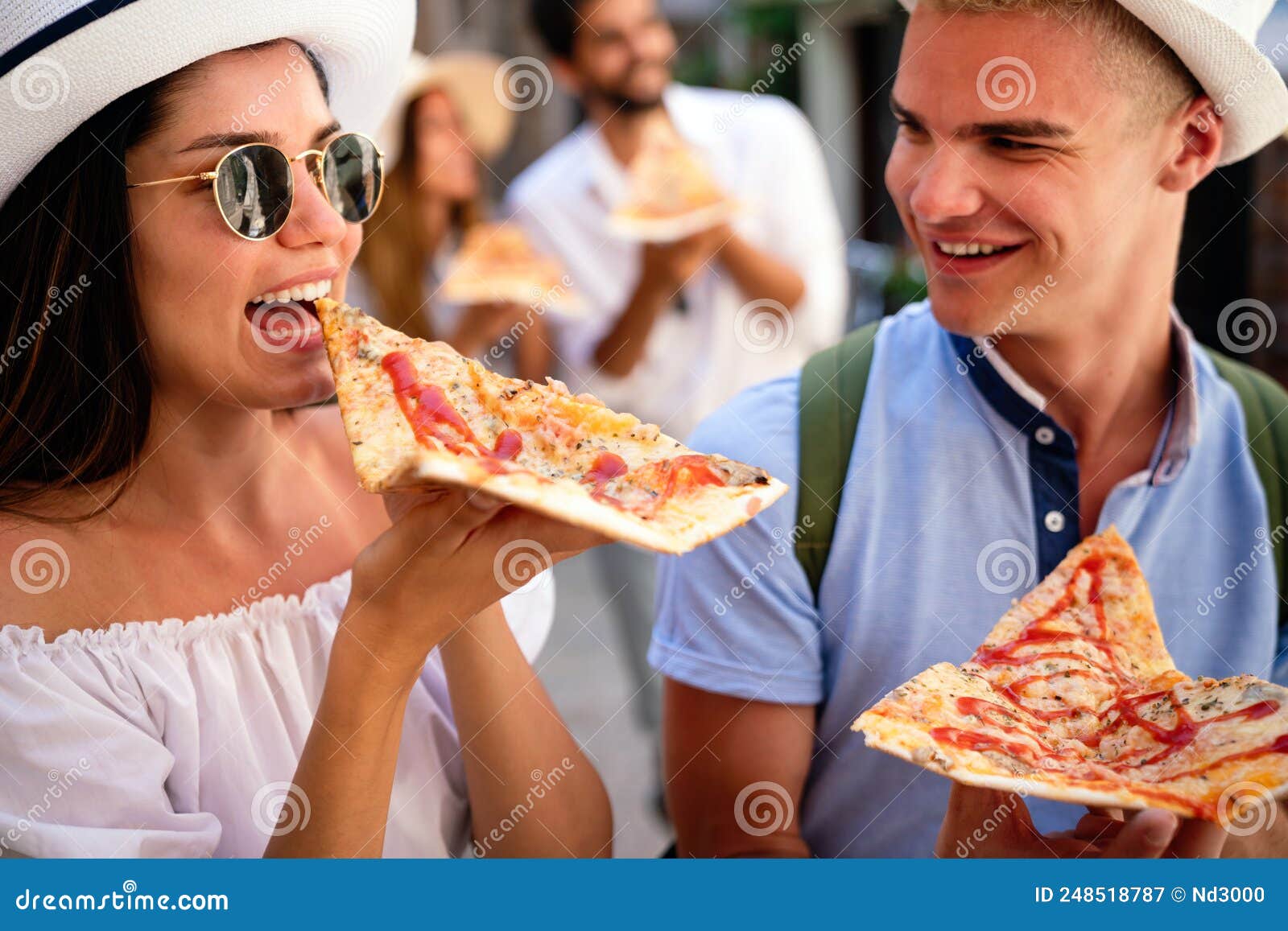 Happy Group of People Eating Pizza Outdoors,they are Enjoying Together ...