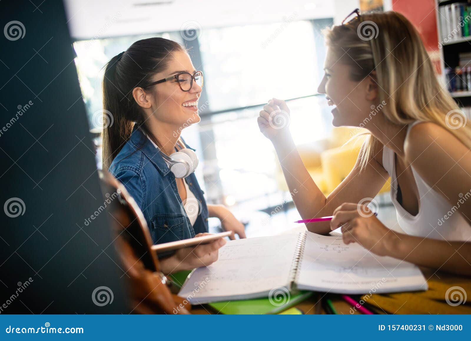 Happy Group of Students Studying and Learning Together in College Stock ...