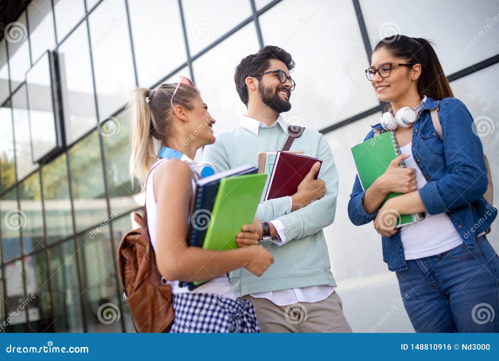 Happy Group of Students Studying and Learning Together in College Stock ...