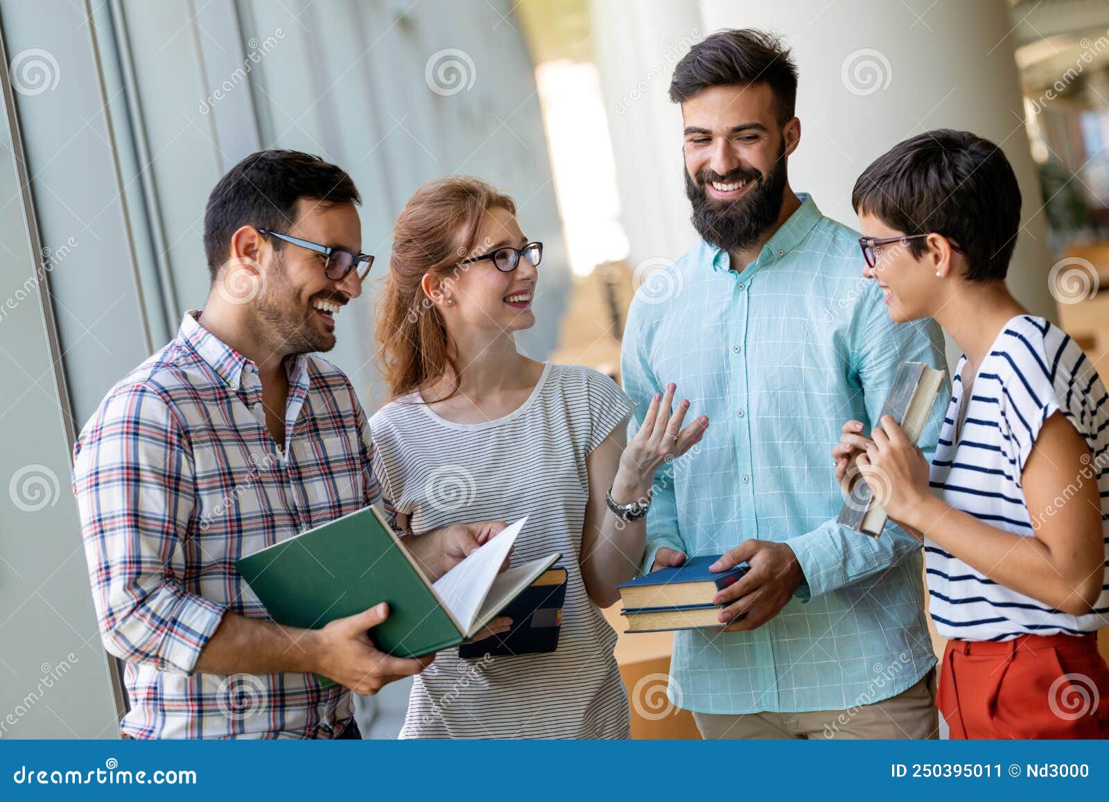 Happy Group of Students Studying and Working Together in a College ...