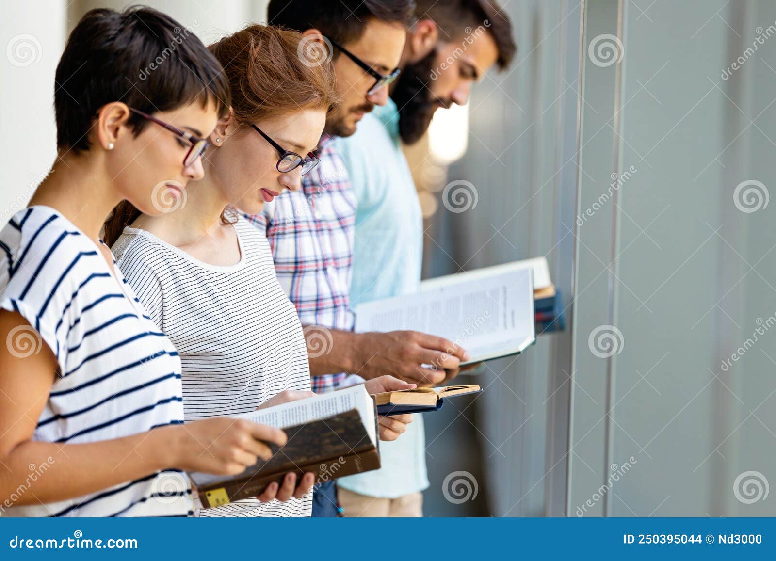 Happy Group of Students Studying and Working Together in a College ...