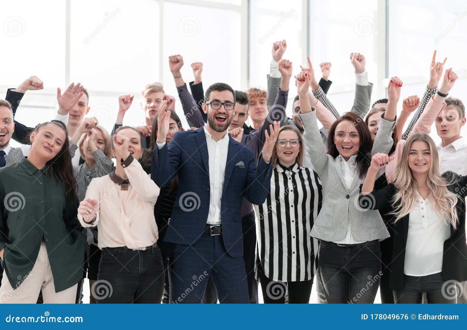 Happy Group of Young Employees with Hands Up Stock Photo - Image of ...