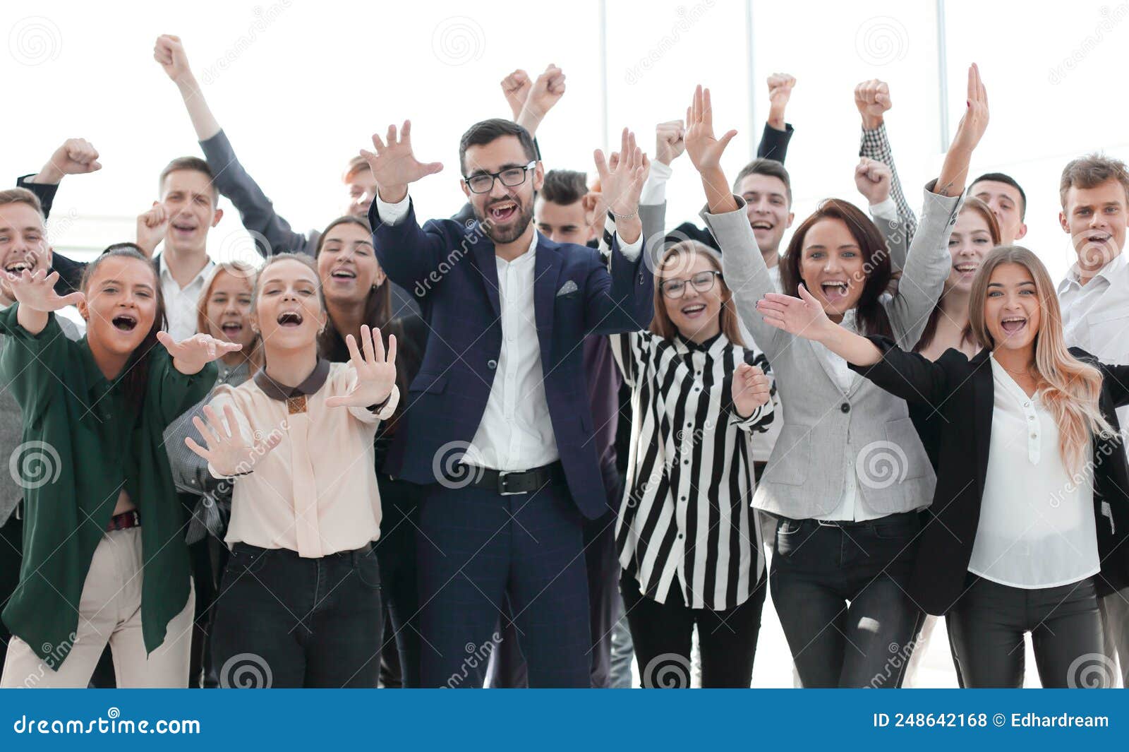 Happy Group of Young Employees with Hands Up Stock Photo - Image of ...