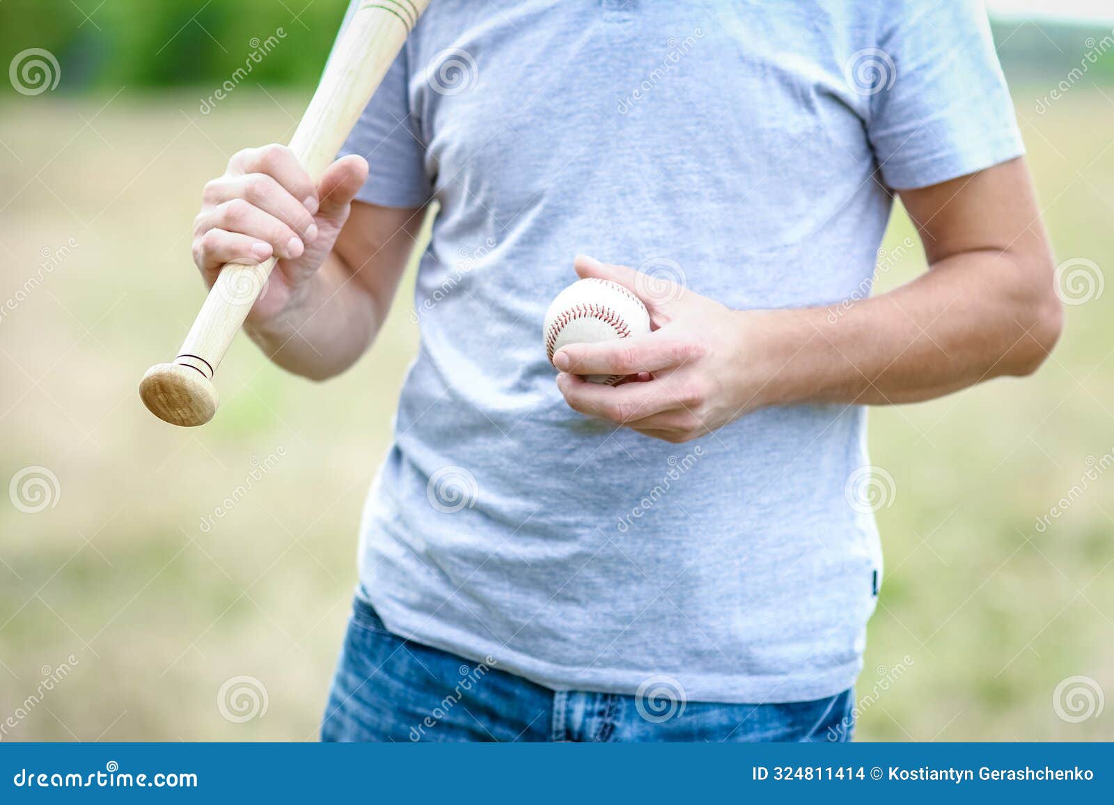 A Happy Guy with Baseball Bat on Nature Concept in Park Stock Photo ...