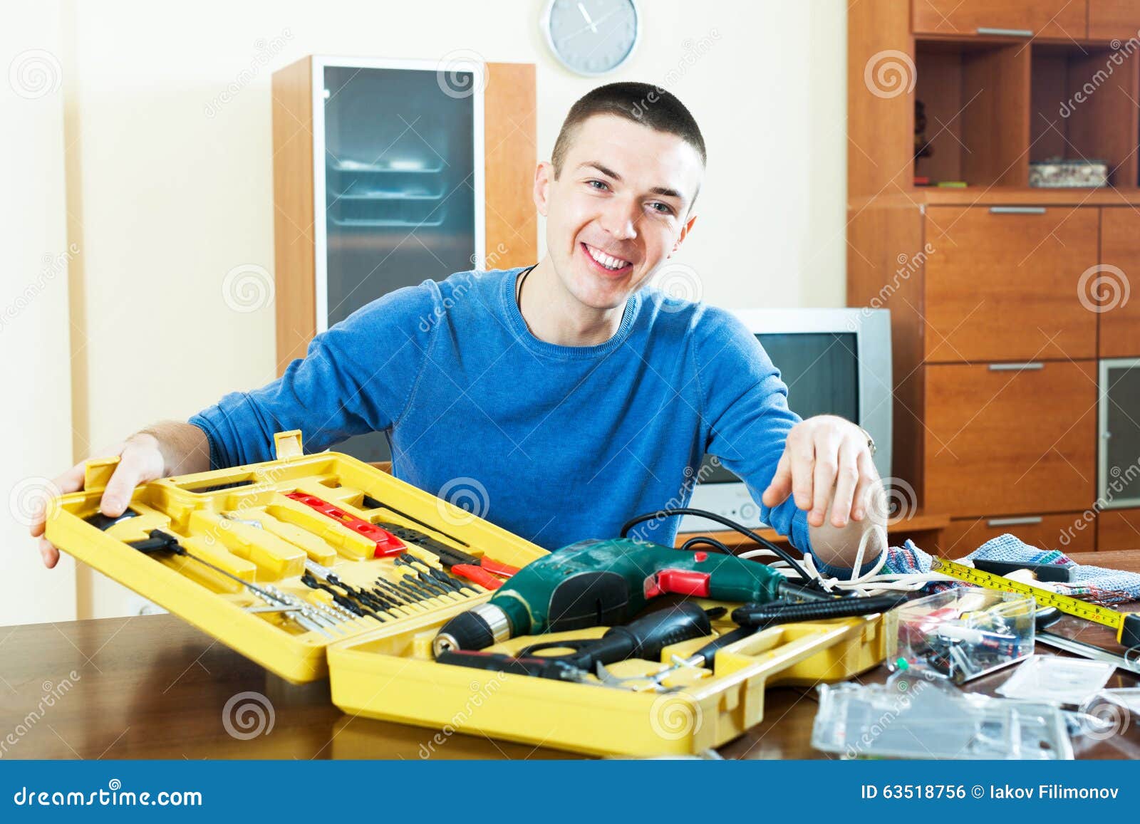 Happy Guy Doing Something with Toolbox in Home Stock Photo - Image of ...