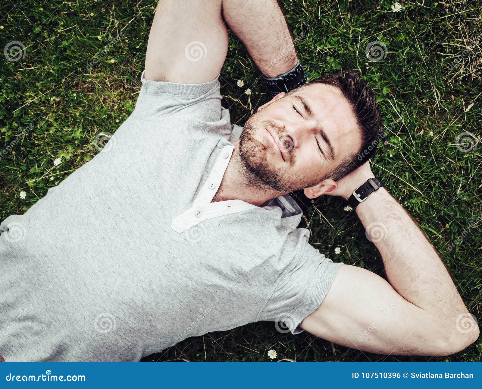 Happy Guy Lying on the Green Grass Stock Photo - Image of lifestyle ...