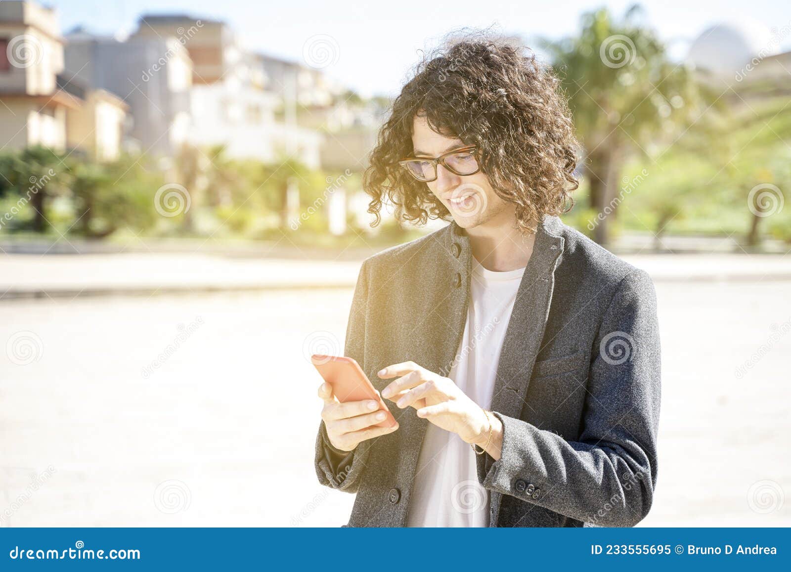 Happy guy sending message stock image. Image of eyeglasses - 233555695