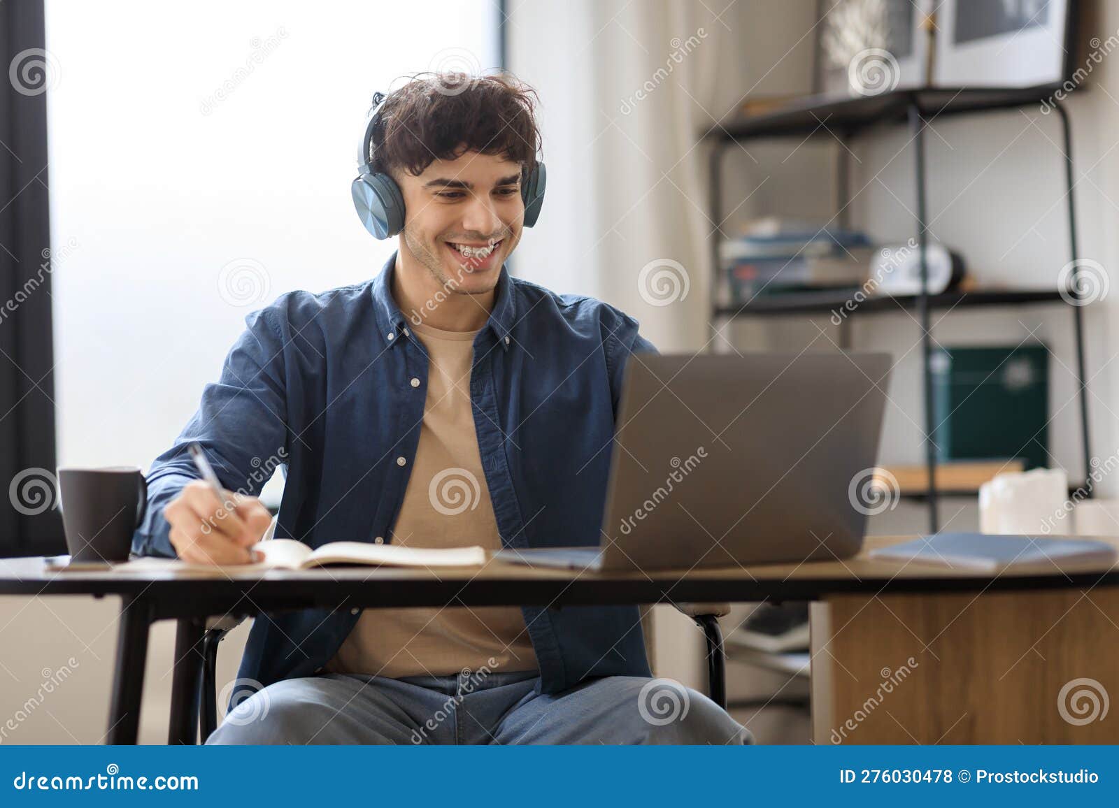 Happy Guy Using Laptop Computer Learning and Working Online Indoors ...