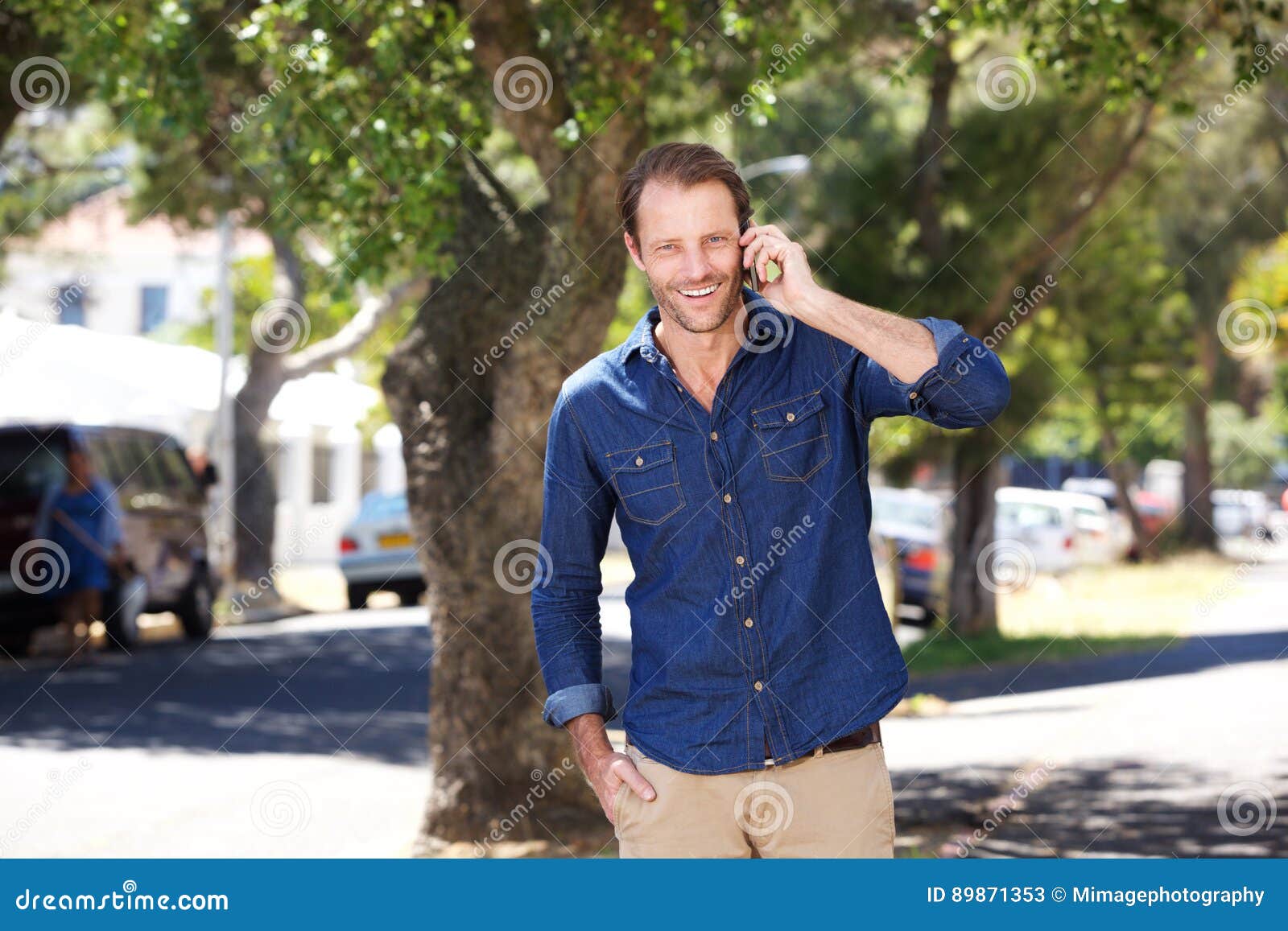 Happy Guy Walking Outside with Cellphone Stock Image - Image of ...