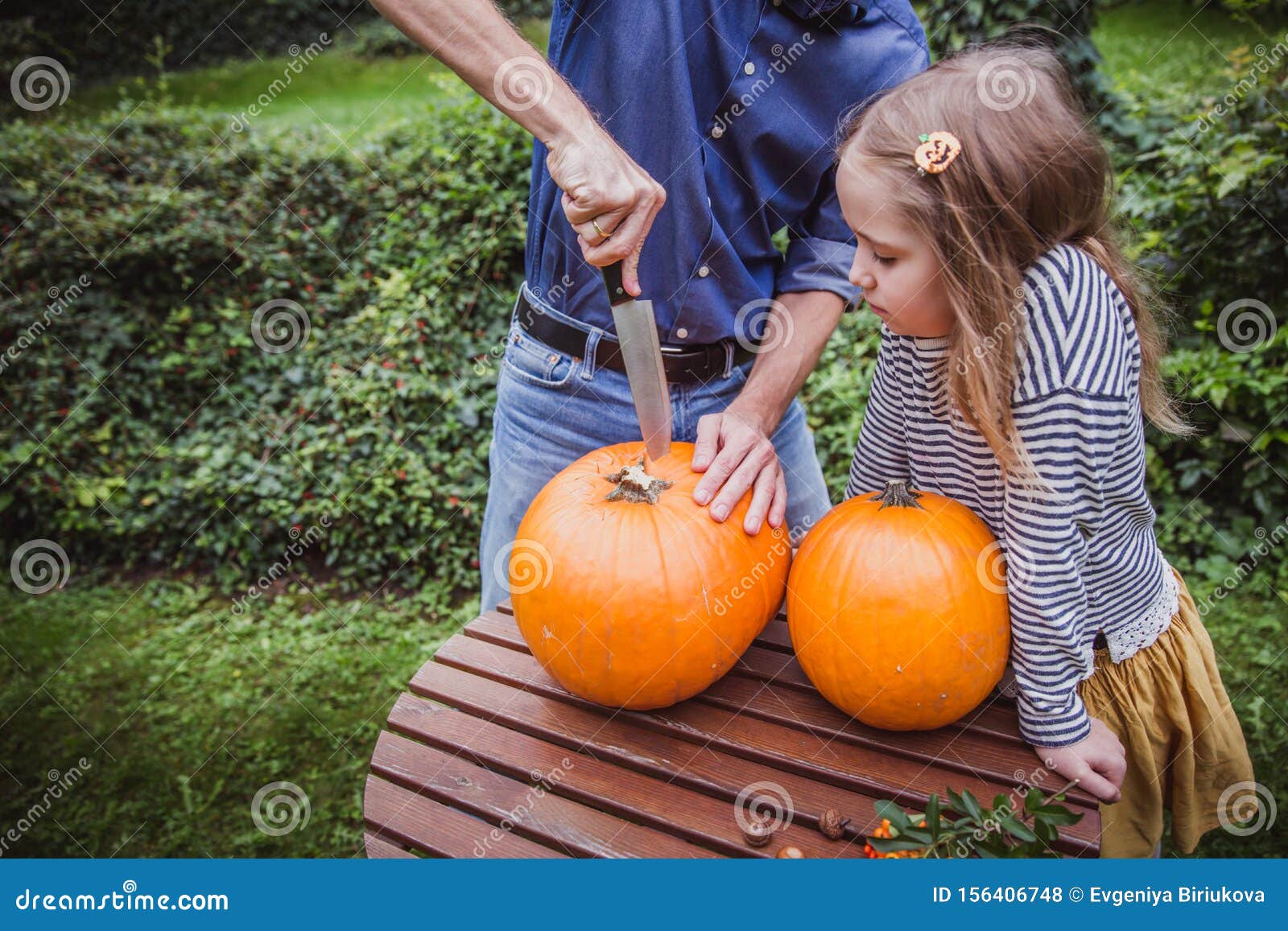 Happy Halloween Father And Daughter Carving Pumpkin For Halloween